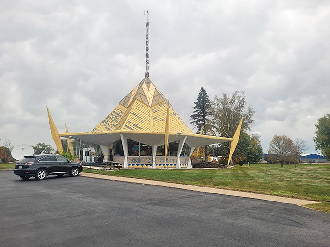 The Wisconsin Pavilion's parking lot might be ordinary, but what awaits visitors is anything but&mdash;a golden pyramid and a colossal cow make quite the pair.