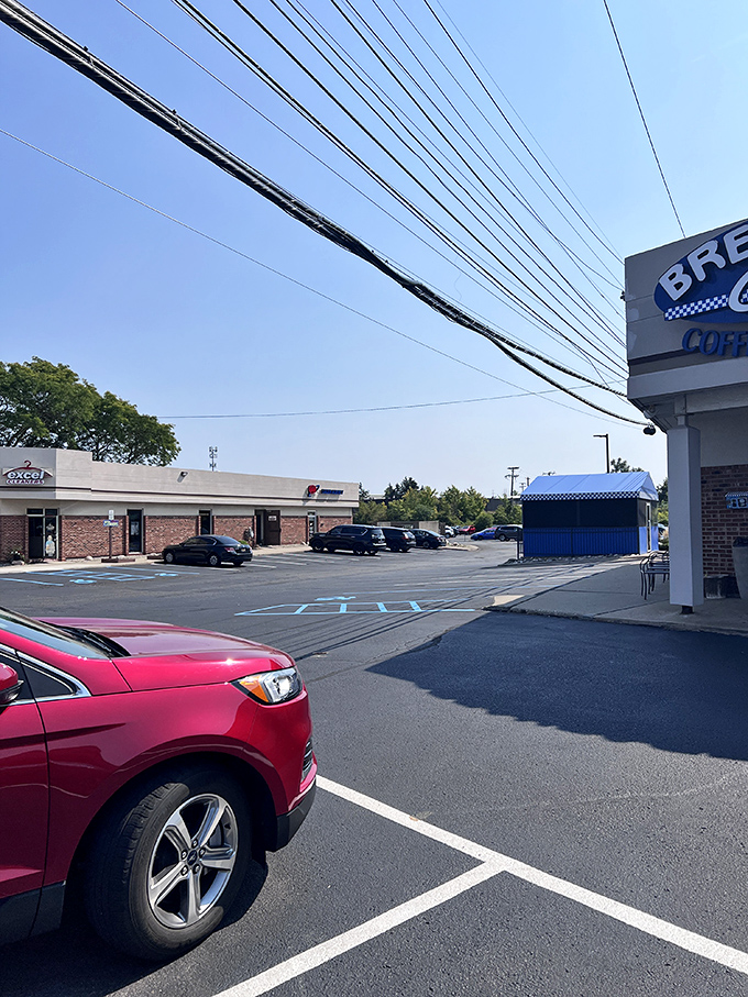 Even the parking lot knows this place is special. Cars gather like hungry pilgrims at a breakfast shrine.