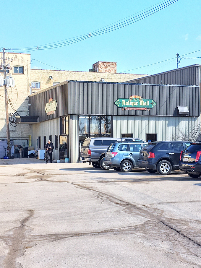 Even the parking lot feels nostalgic, with the vintage sign promising adventures in time travel just beyond those unassuming metal doors.