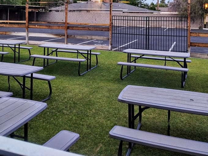 Picnic tables on grass &ndash; because sometimes the most perfect barbecue experience channels your inner eight-year-old at a family reunion, minus the awkward conversations.