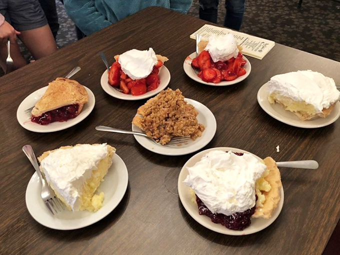 Pie paradise! Seven different slices of heaven on one table. The only real question is: do you start with fruit or cream? (The correct answer is "both").
