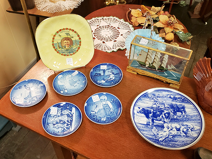 Blue and white porcelain plates that survived decades of Sunday dinners now wait for their next home, surrounded by doilies and maritime memories.