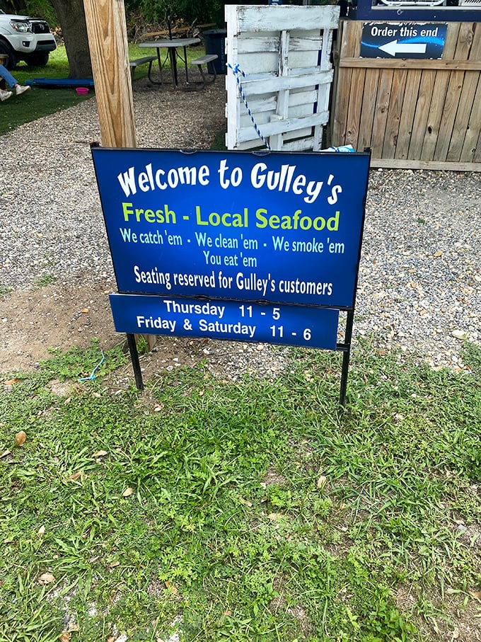 We catch 'em, we clean 'em, we smoke 'em, you eat 'em. The most beautiful poetry ever written on a blue sign in Parrish, Florida.