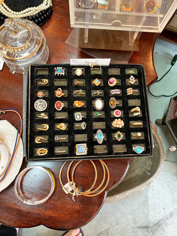 A treasure chest of rings that would make a pirate weep with joy. Each one carries stories of celebrations, promises, and style eras past.