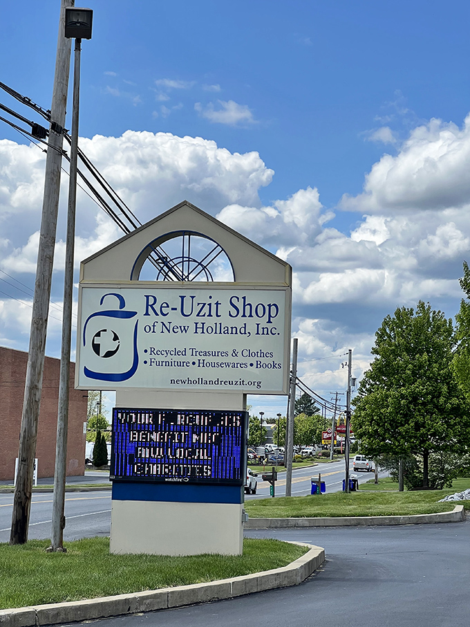The sign says it all: "Recycled Treasures & Clothes." Plus that digital board announcing how your shopping habit is actually helping local charities.
