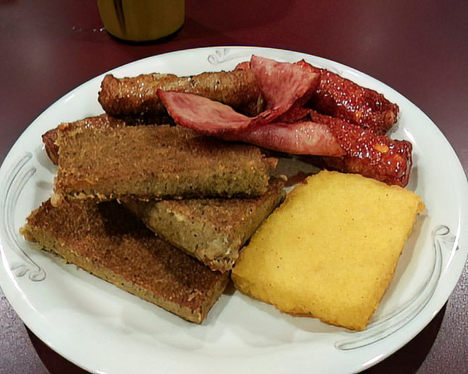 Scrapple and breakfast meats &ndash; Pennsylvania Dutch tradition on a plate, proving that nothing honors an animal like using everything.