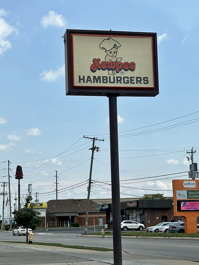 That Kewpee sign against the Ohio sky&mdash;not just a logo, but a landmark that's guided hungry travelers for generations.