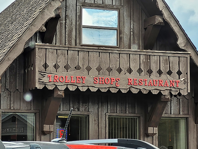 The weathered wooden sign announces your arrival at breakfast paradise with the straightforward pride of a place that lets its food do the talking.