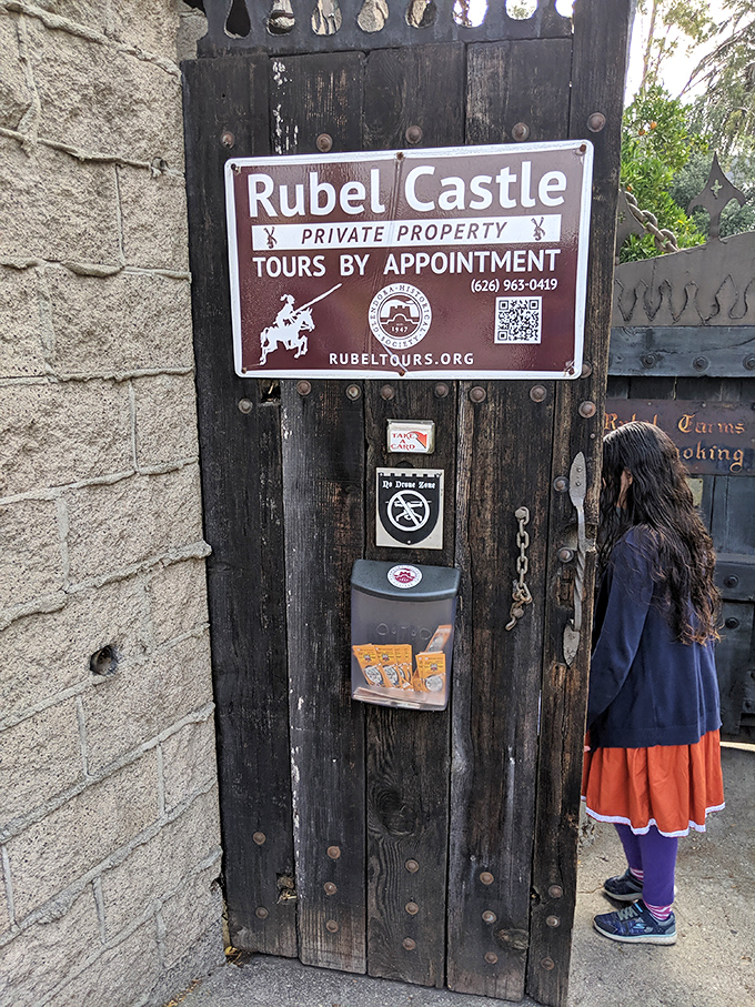 "By appointment only" has never looked so intriguing. The castle's entrance sign hints at the wonders waiting just beyond the wooden door.