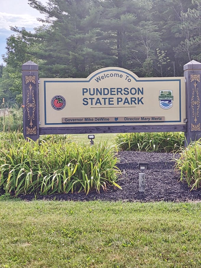 The gateway to adventure &ndash; where this unassuming sign marks the boundary between ordinary life and natural wonder.