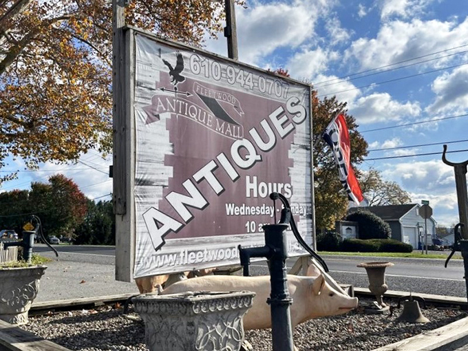 The sign says "Antiques" but might as well read "Time Travel Portal: All Major Credit Cards Accepted."