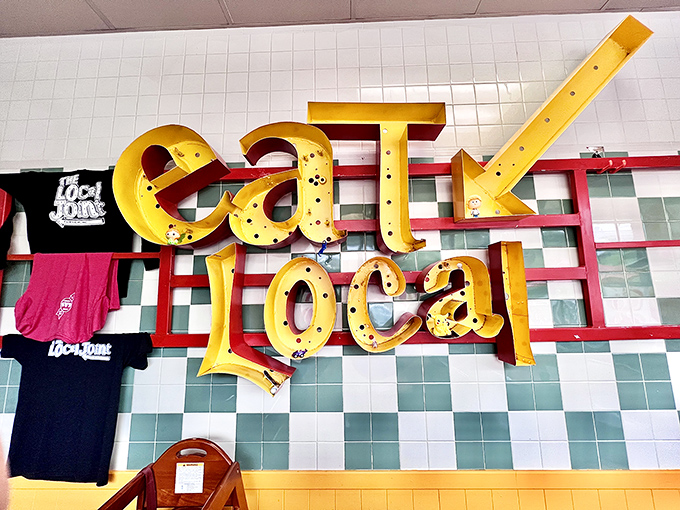 The "eat local" philosophy shines through in signage that celebrates community dining and neighborhood pride perfectly.