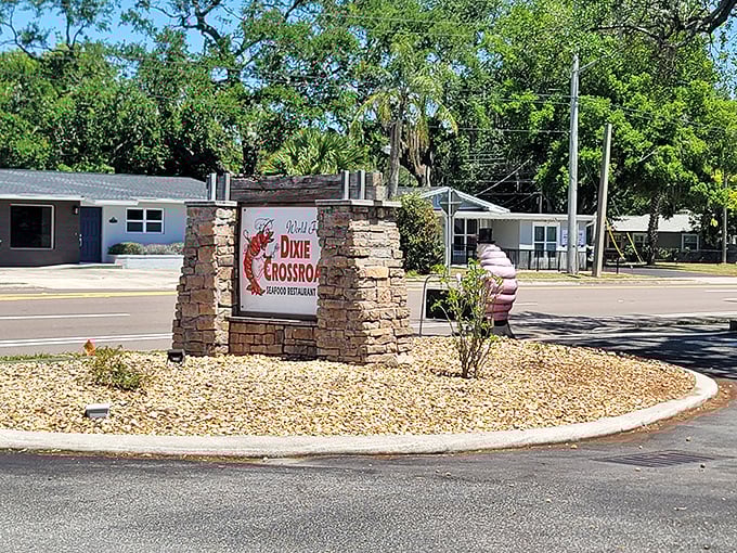 The roadside sign stands as a landmark for locals and a discovery for travelers &ndash; the first hint of the seafood paradise waiting just beyond.