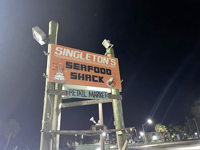 The sign that's guided hungry travelers like a seafood lighthouse through many a Florida night. No fancy fonts needed when the food speaks this loudly.