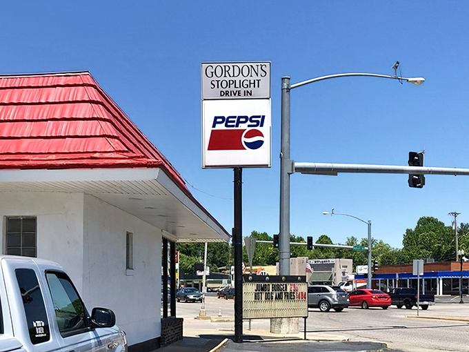 The sign tells you where to stop, but your nose would have figured it out anyway. Burger navigation at its finest.
