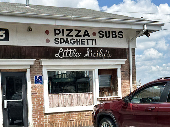 The sign says everything you need to know &ndash; no fancy font tricks or buzzwords, just the honest promise of pizza, subs, and spaghetti.