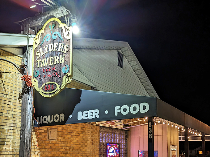 At night, the Slyder's sign becomes a beacon for hungry souls seeking refuge from chain restaurant mediocrity.