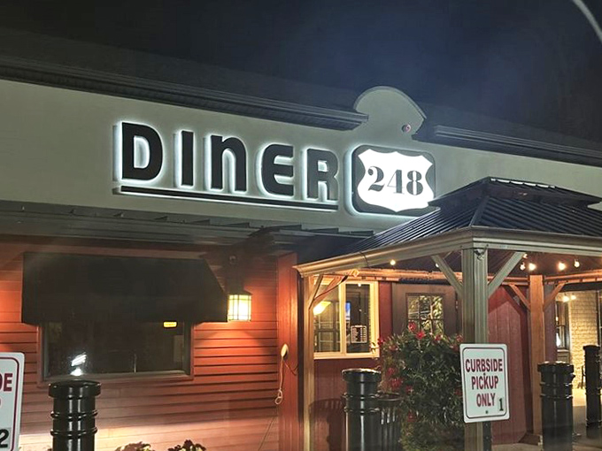 As night falls, the Diner 248 sign glows with the warm promise of comfort food, proving that some beacons guide you not home, but to your next great meal.