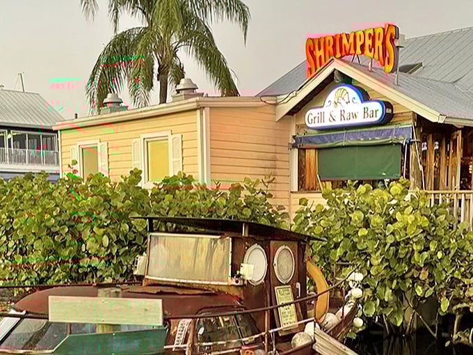 That iconic Shrimper's sign&mdash;like a beacon for hungry travelers, promising seafood salvation just beyond those sea grape leaves.