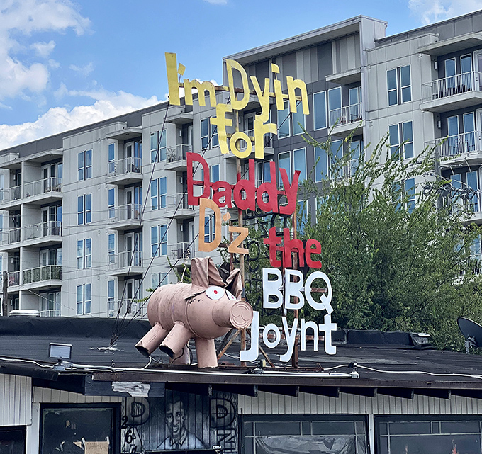 That iconic sign against Atlanta's evolving skyline—a testament to staying true to your roots while the world changes around you.