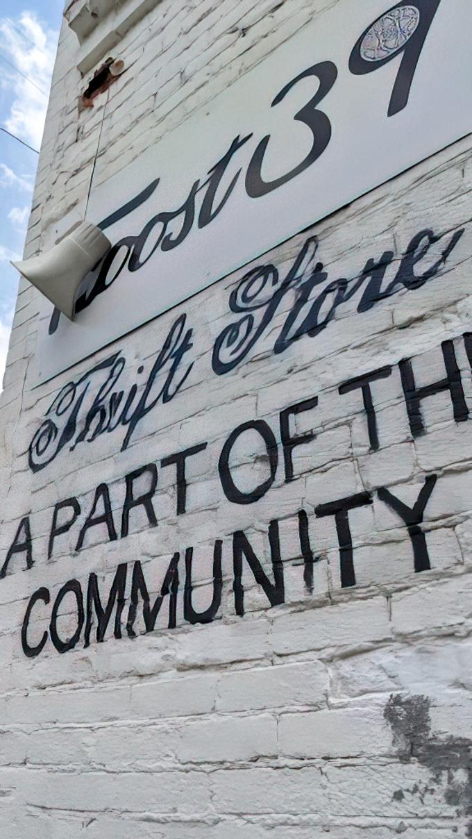 More than just a store – Troost39's wall proudly declares its community mission behind every bargain and treasure.