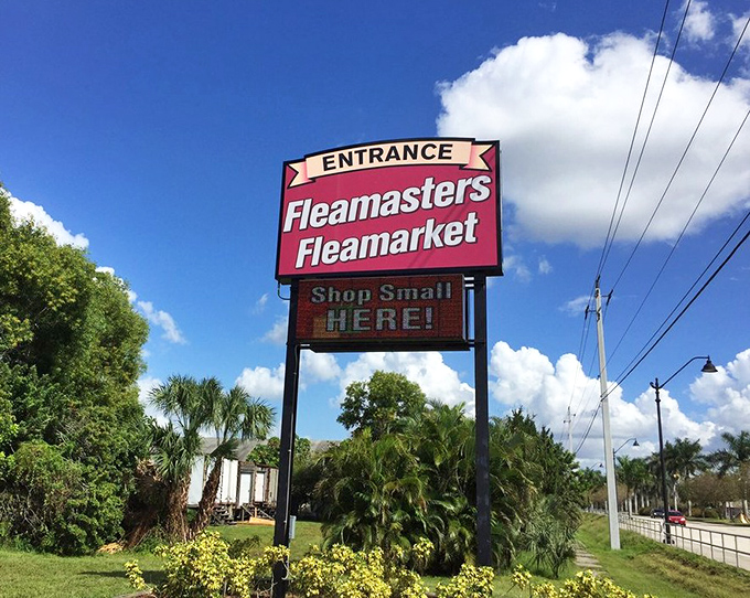 The iconic Fleamasters sign stands tall against the Florida sky, a beacon calling to bargain hunters like moths to a fluorescent flame.