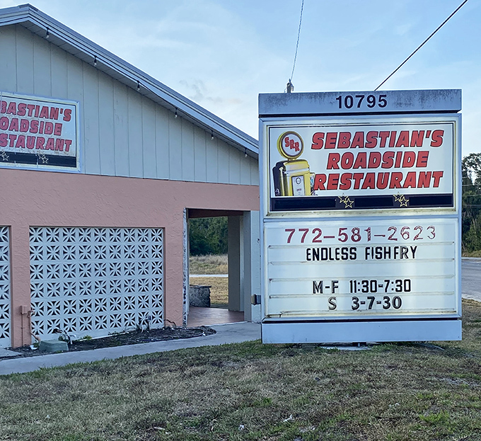 Dawn breaks over Sebastian's pink-hued exterior. The sign promises "Endless Fishfry" &ndash; two words that might just be worth planning your week around.