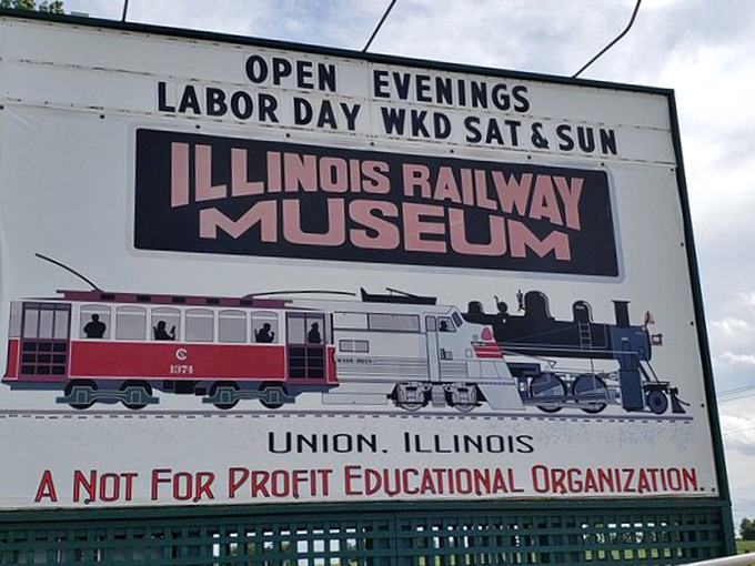 The museum's sign proudly announces its non-profit educational mission, inviting visitors to discover the stories behind America's railroad heritage.