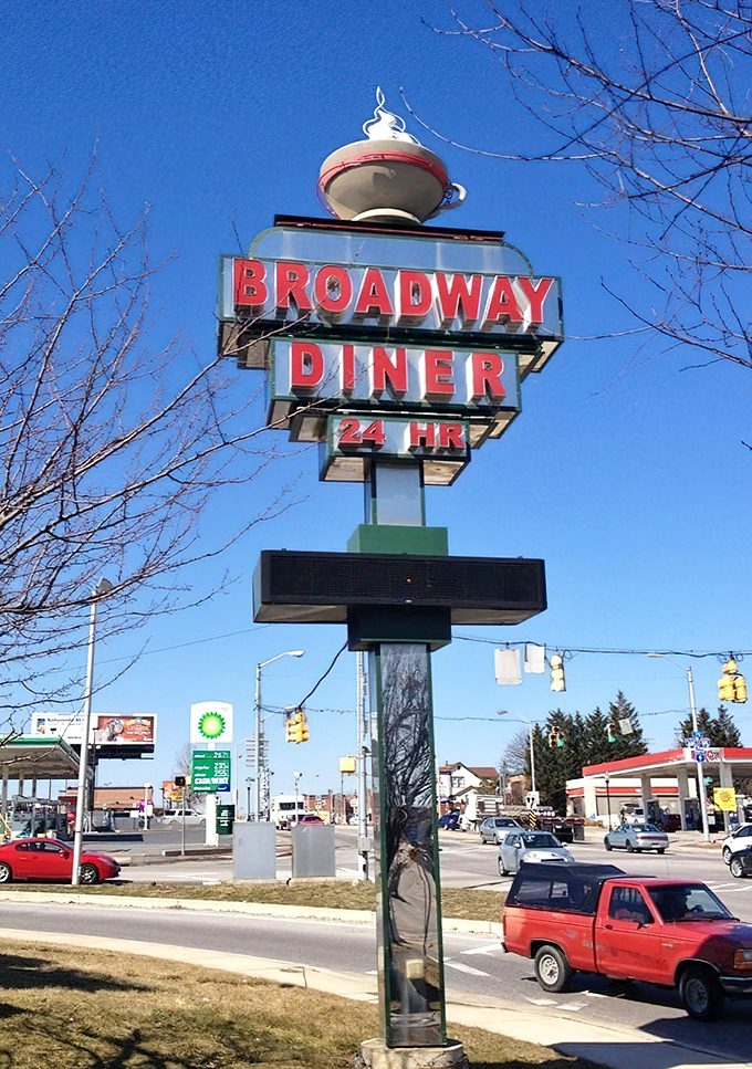 The skyward coffee cup sign stands as Baltimore's own North Star – guiding hungry travelers toward comfort food salvation 24 hours a day.