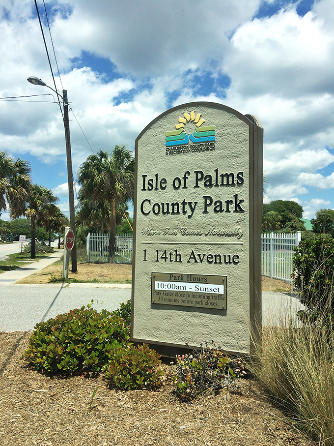 The official welcome sign promises "Where Fun Comes Naturally," a slogan that understates the coastal magic waiting just beyond the entrance.