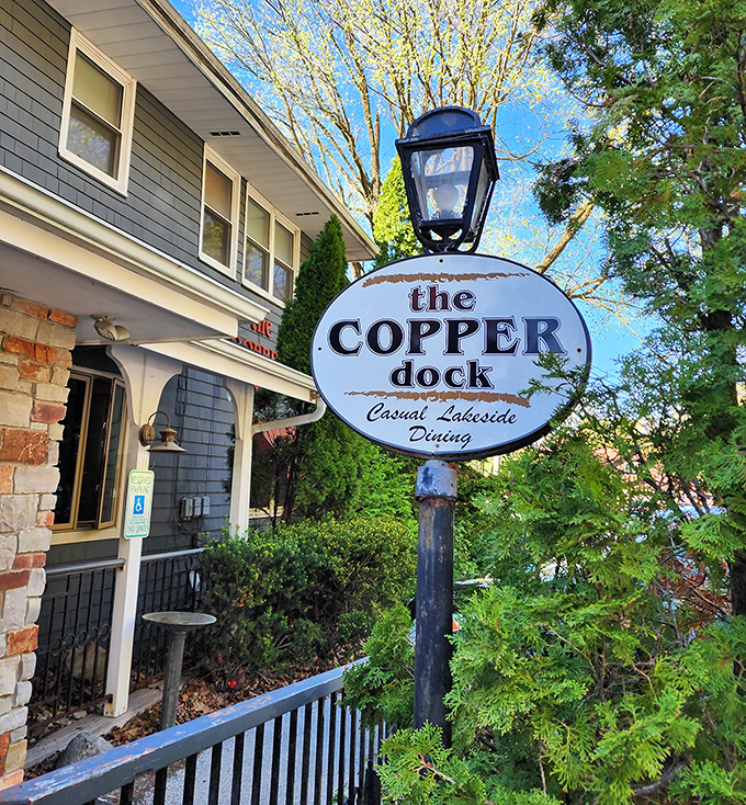 The charming sign welcomes you like an old friend, promising "Casual Lakeside Dining" that somehow always exceeds those modest expectations.