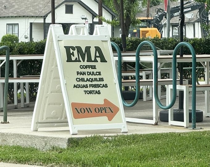 The sidewalk sign doesn't just announce "EMA"&mdash;it promises coffee, pan dulce, and chilaquiles, the holy trinity of morning happiness in Houston.