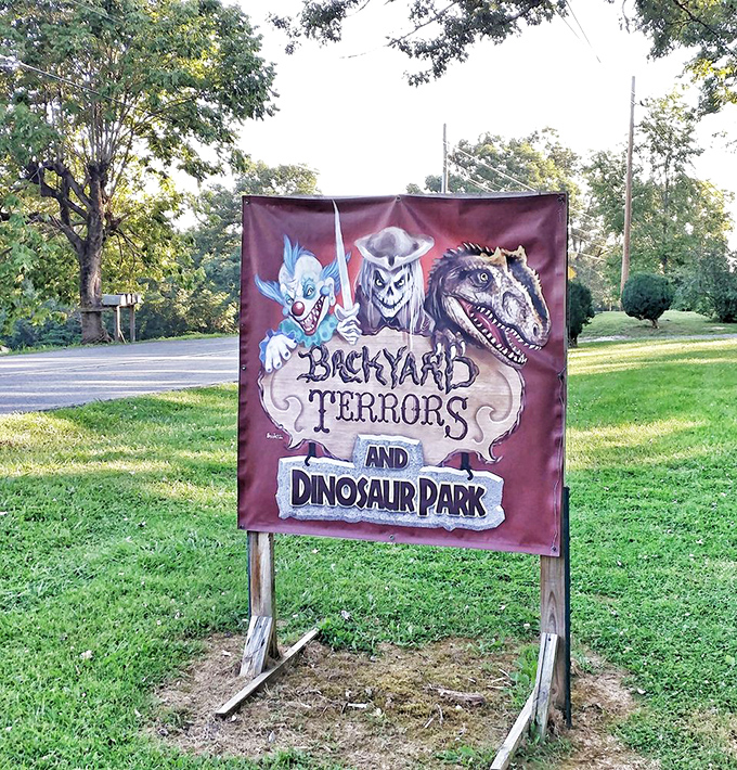 The roadside banner announces "Backyard Terrors and Dinosaur Park," proving that sometimes the best attractions aren't the ones with the biggest marketing budgets.
