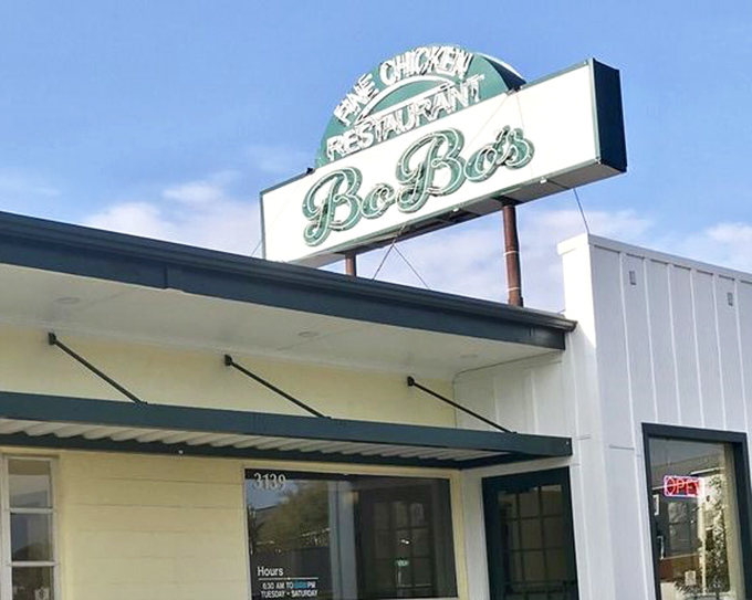 That vintage-style sign isn't just advertising chicken; it's a beacon guiding hungry souls toward their next favorite meal.