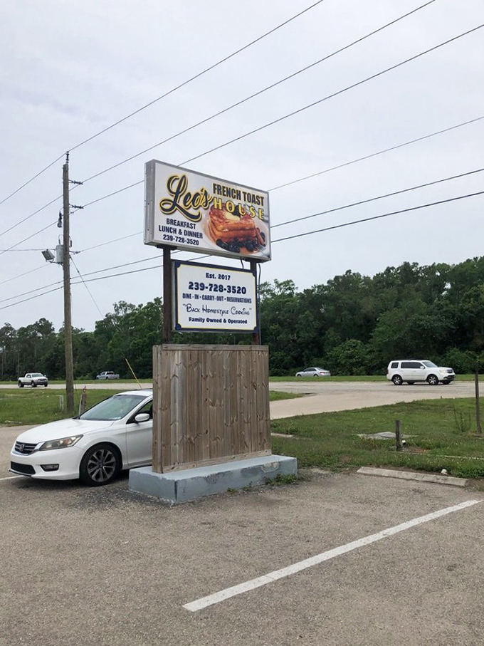 The roadside sign stands tall, a beacon for hungry travelers. "French Toast House" &ndash; two words that promise delicious things await.