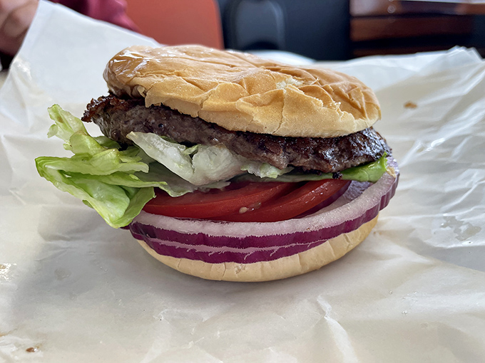 Fresh veggies, vibrant colors, and a perfectly charred patty. This burger proves simplicity is the ultimate sophistication in the burger world.