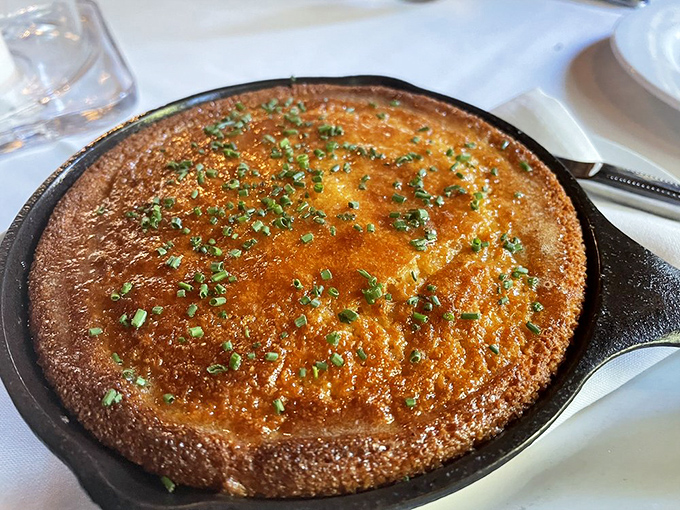 Cast iron cornbread arrives bubbling hot, turning simple comfort food into something absolutely extraordinary.