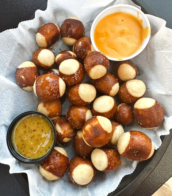 Pretzel bites with dipping sauces&mdash;the perfect cellmates for your craft beer. No shivs required to enjoy this starter.