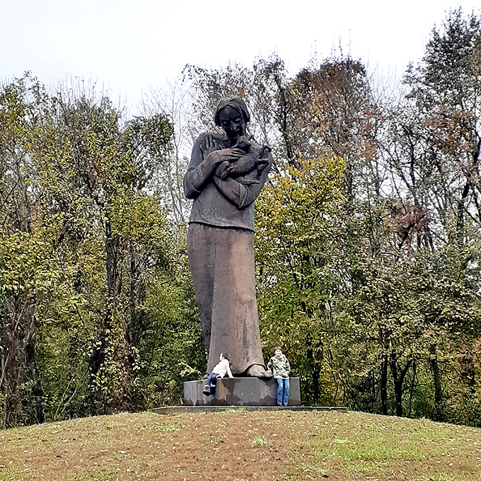 This stoic sentinel watches over the forest, reminding visitors of humanity's connection to nature. Silent wisdom cast in permanent form.