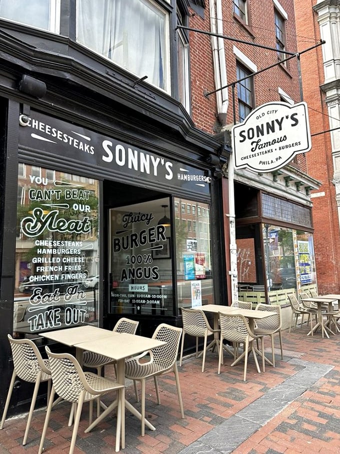 The storefront beacon that calls to hungry souls wandering Old City. That sign promises salvation in sandwich form, and it absolutely delivers.