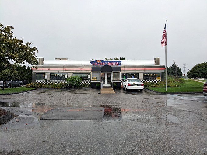Even on a rainy day, The Grand Diner's classic silhouette stands as a beacon of breakfast hope. That American flag adds a touch of heartland pride.