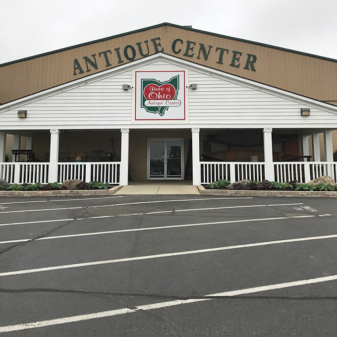 The unassuming exterior hides the wonderland within. Heart of Ohio Antique Center's classic white porch welcomes treasure hunters from across the Midwest.