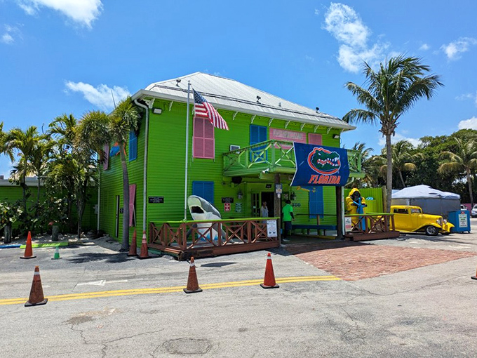 A building painted in colors so cheerful it practically shouts "vacation!" Even the palm trees seem to be dancing in agreement.