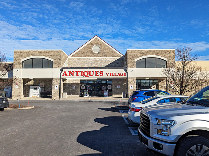 The unassuming exterior of Antiques Village gives no hint of the 65,000 square feet of treasures waiting inside—like a time-travel portal disguised as a strip mall.