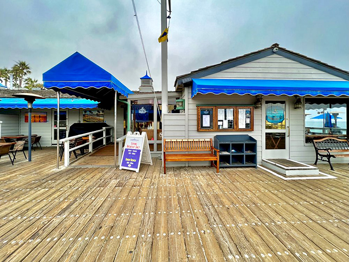 The entrance that promises seafood salvation. Those blue awnings signal you've arrived at the place where hunger meets happiness.