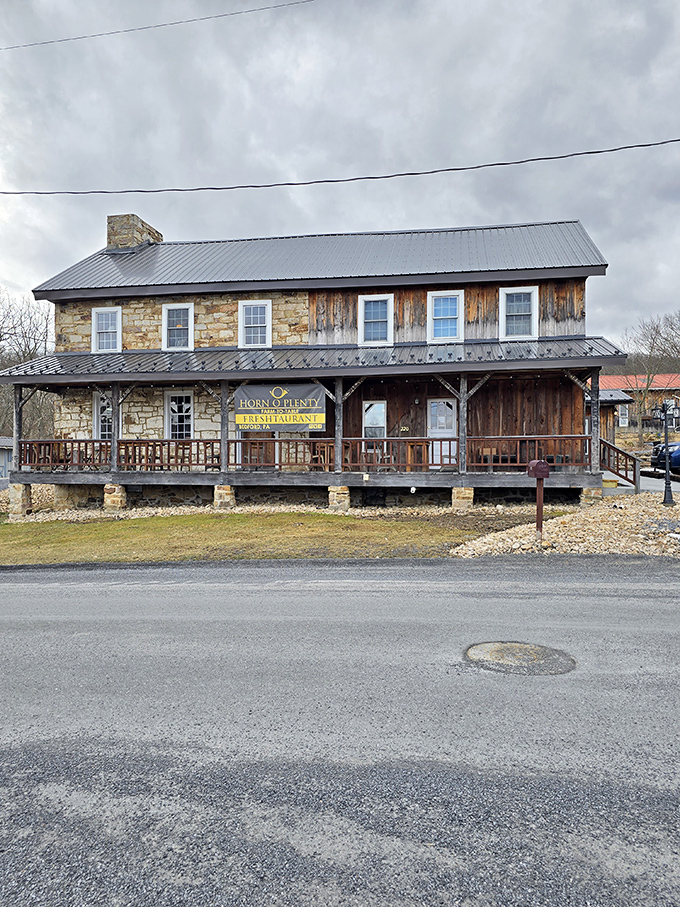 The storefront stands as a testament to architectural honesty&mdash;stone, wood, and metal coming together to say "yes, there's something special happening inside."