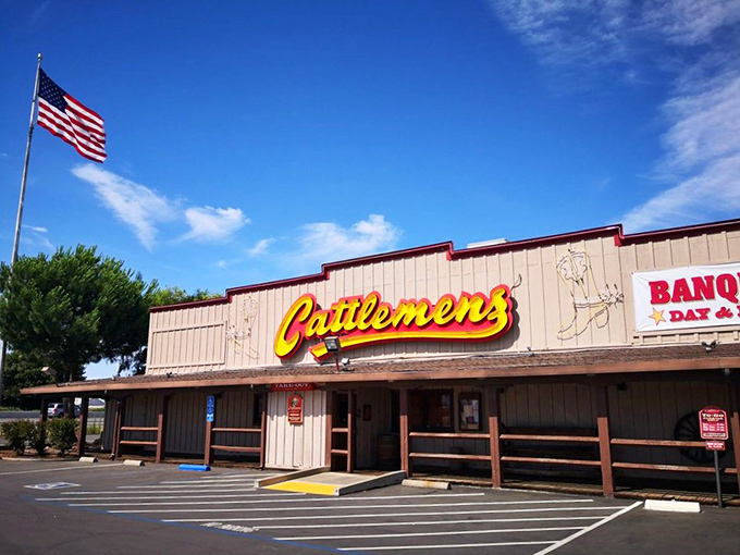 Under clear California skies, that iconic yellow sign beckons like a beacon to the beef-obsessed. The American flag adds a touch of heartland pride.