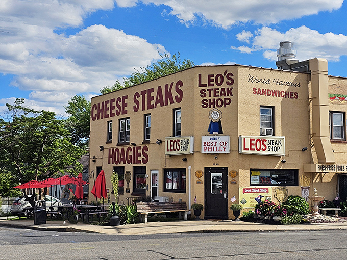 "CHEESE STEAKS" and "HOAGIES" emblazoned like a siren call. This tan building houses more happiness per square foot than most places.