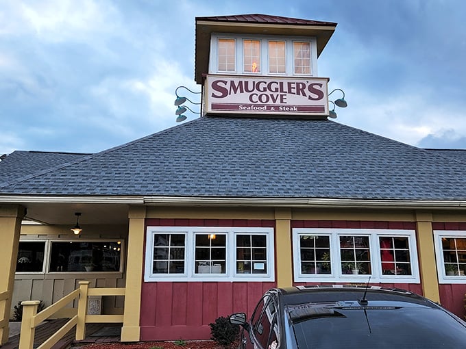 The Smuggler's Cove sign glows like a beacon as dusk settles over Tannersville. It's not just a restaurant sign; it's a promise of the feast that awaits.