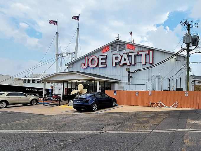 American flags flutter above the distinctive white building, where the Gulf's bounty meets Pensacola tradition in the most delicious way possible.